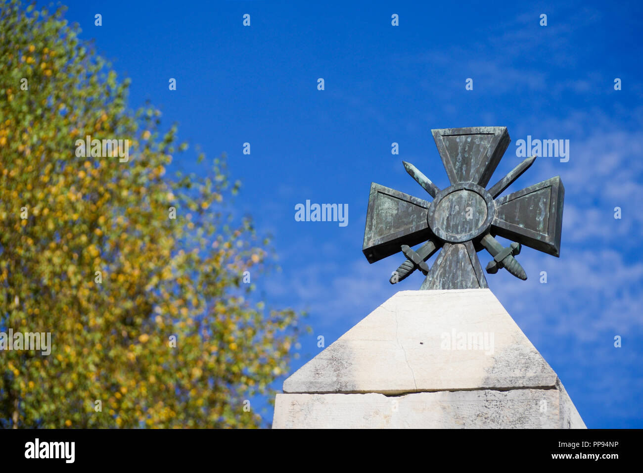 Military cross on top of the War memorial, Saint-Hugues de Chartreuse ...
