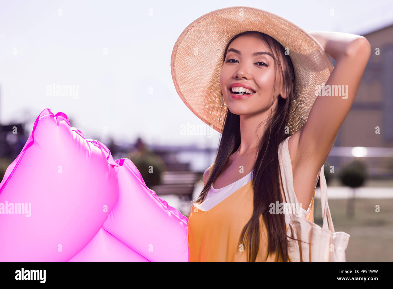 Delighted happy Asian woman smiling to you Stock Photo - Alamy