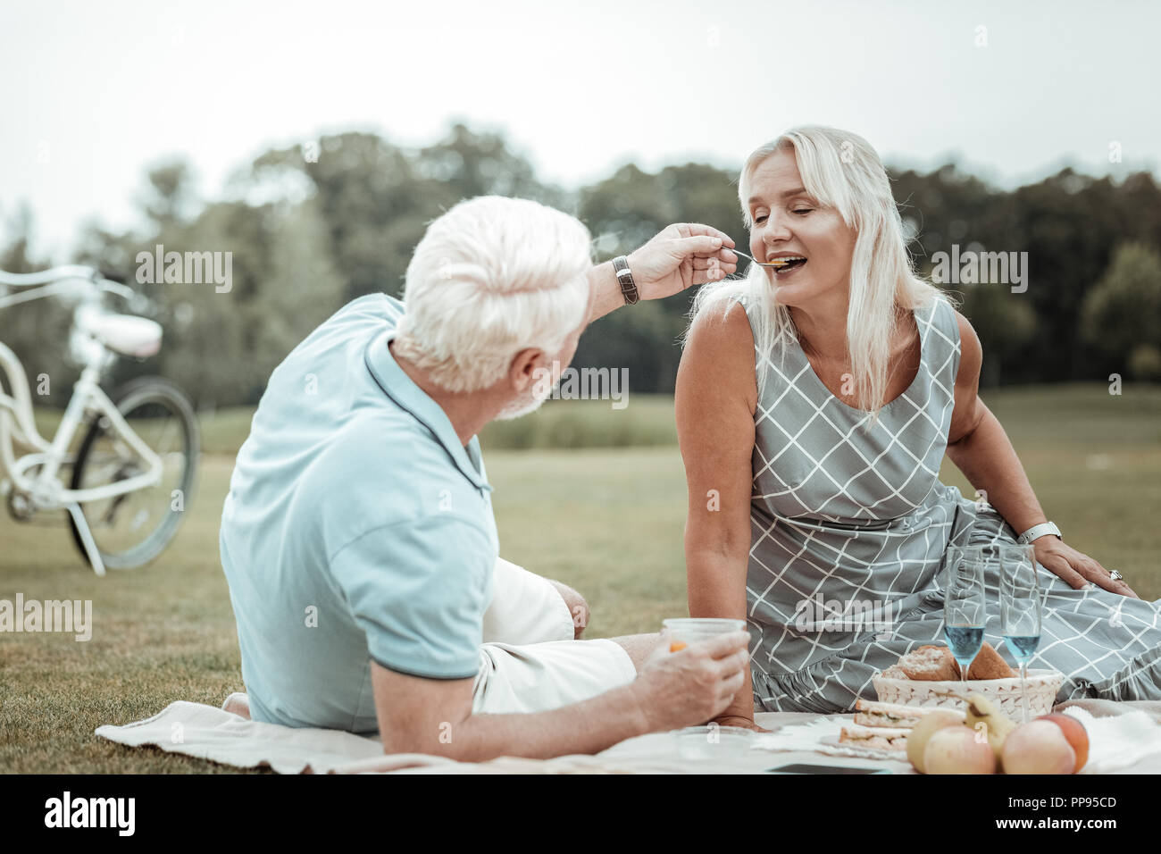 Kind female person enjoying her time with husband Stock Photo - Alamy