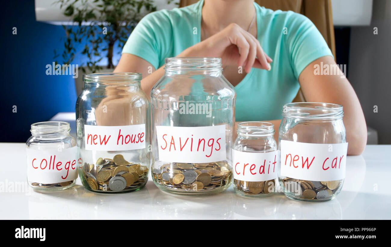 Closeup photo of young woman thinking of managing her money savings ...