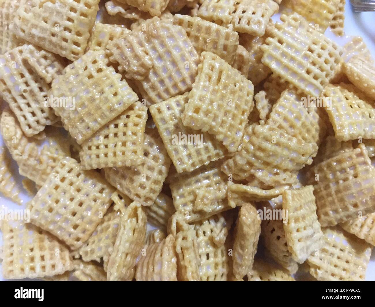 Square cereal and milk, tan in color Stock Photo - Alamy