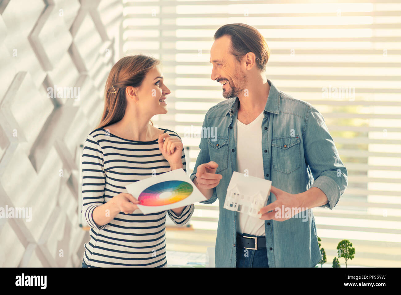 Pretty girl telling her idea to main engineer Stock Photo - Alamy