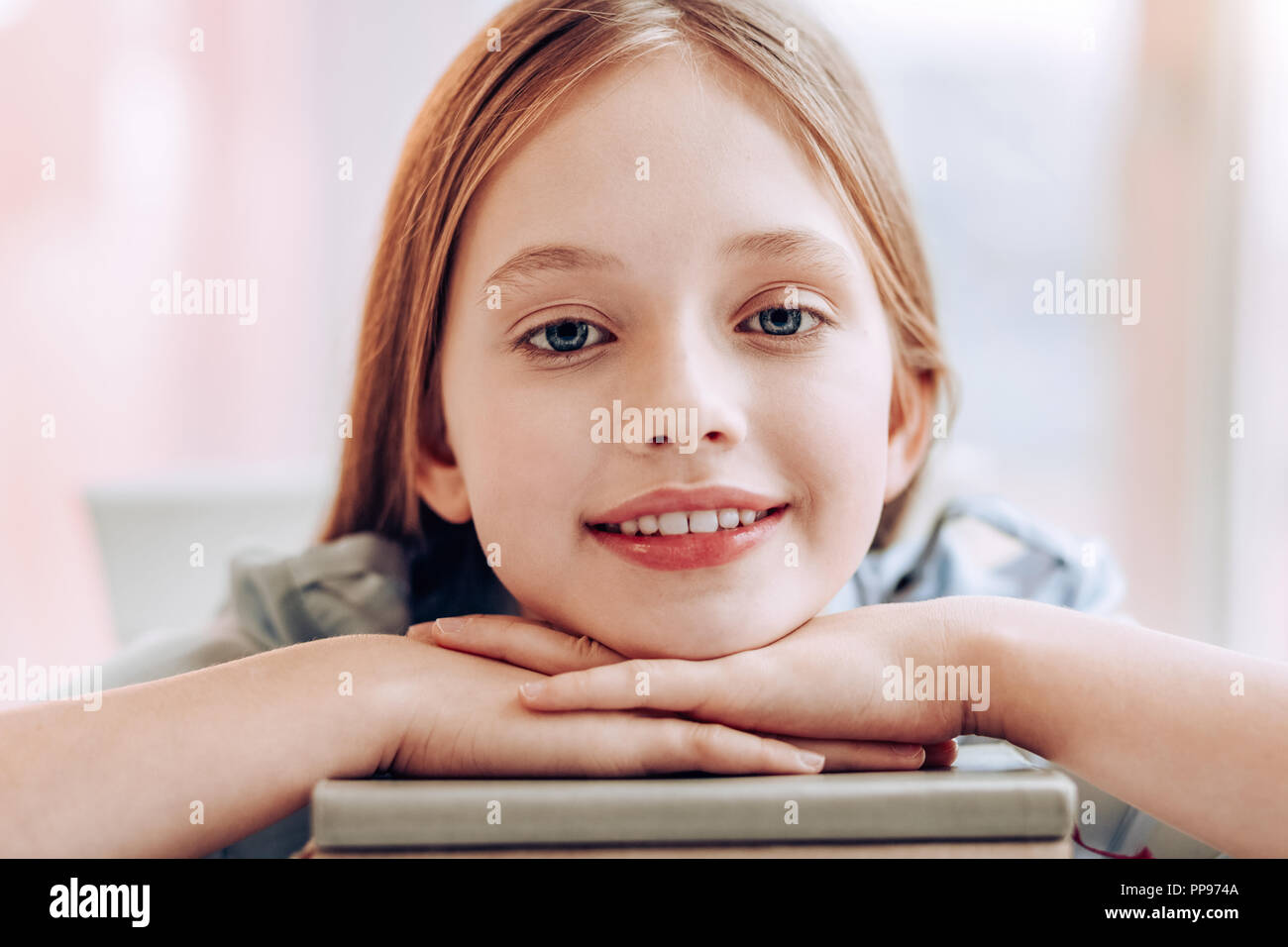 Portrait of charming girl that looking straight at camera Stock Photo ...