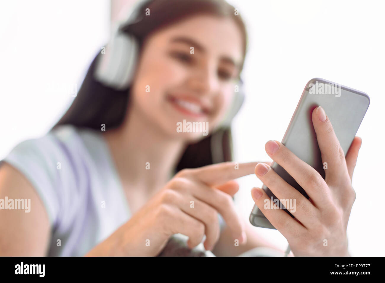 Silhouette of smiling girl that typing message Stock Photo - Alamy