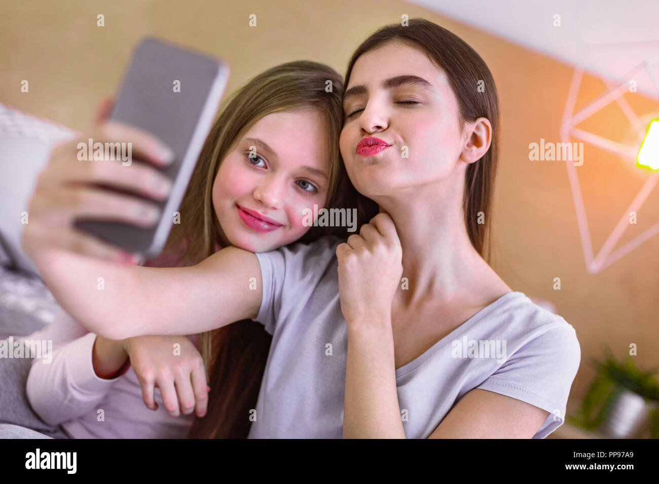 Joyful teenagers making faces on their camera Stock Photo - Alamy