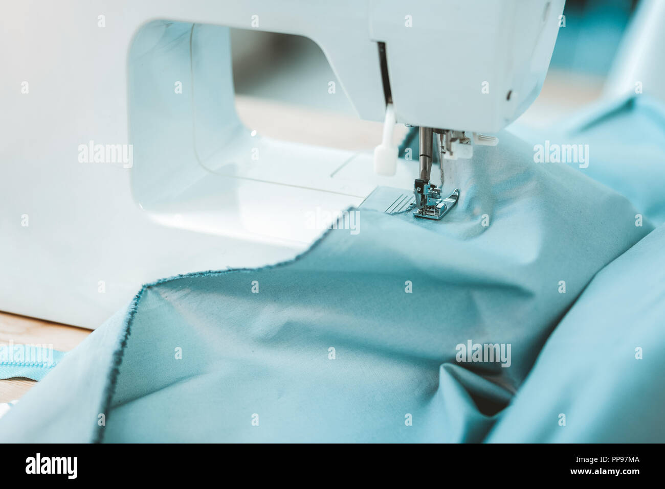 Close up of sewing machine while working Stock Photo - Alamy