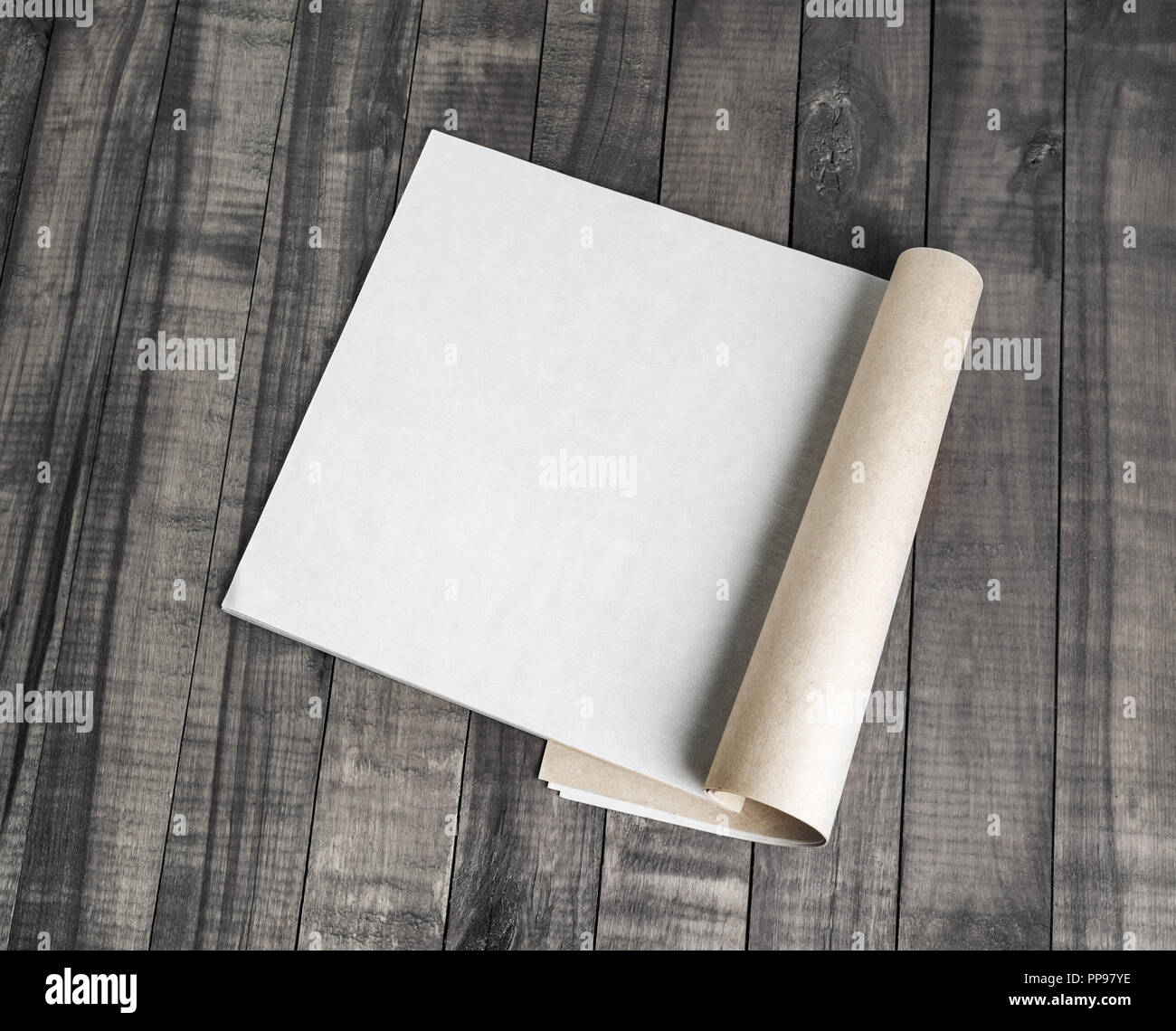 Blank magazine on wood table background. Template for placing your ...