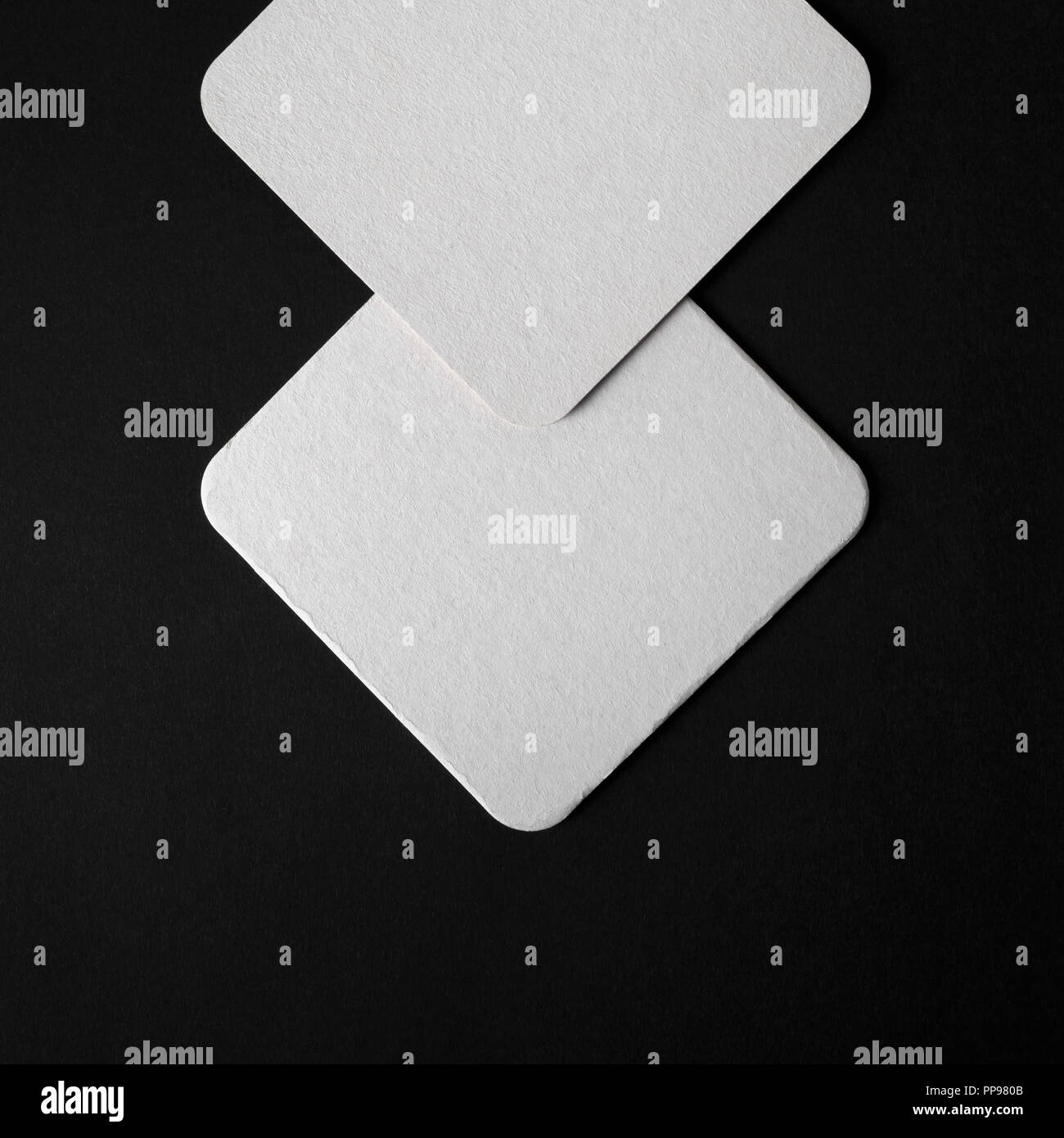 Square beer coasters mockup on black background. Responsive design ...