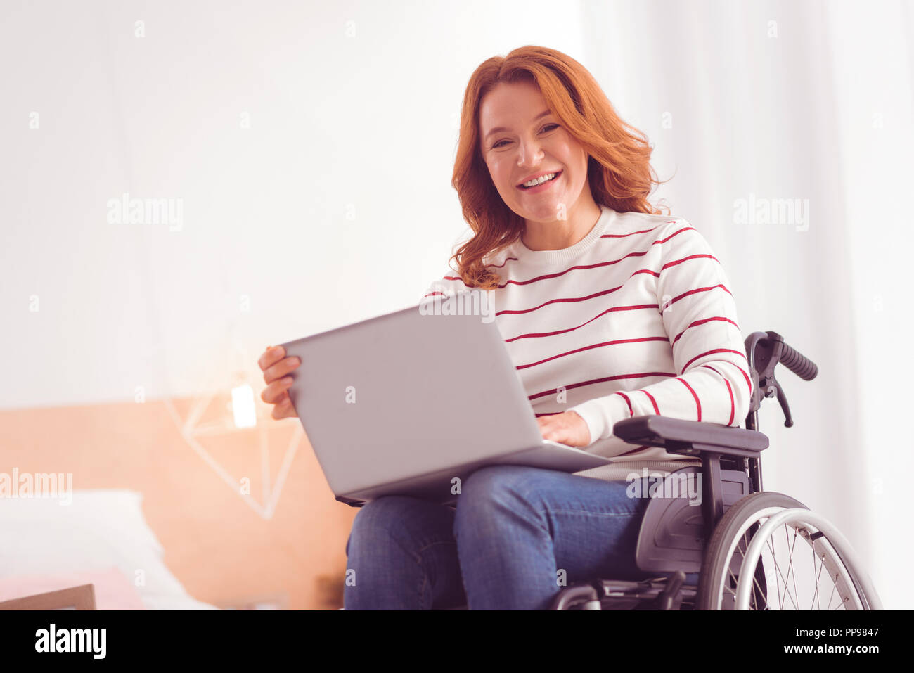 Happy disabled female freelancer working at home Stock Photo - Alamy