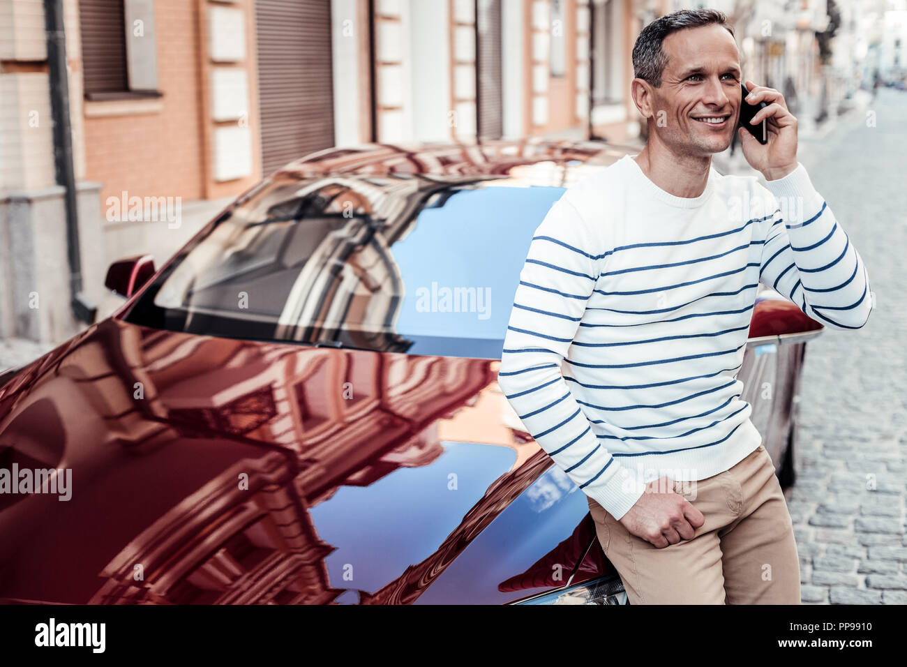 Handsome male using his smartphone Stock Photo - Alamy