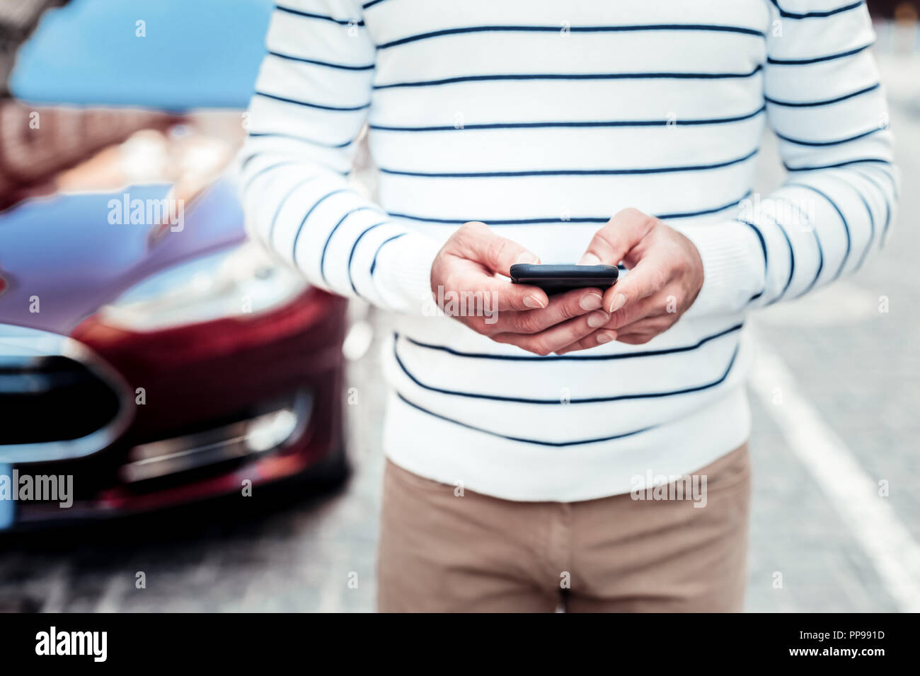 Relaxed man typing answering message Stock Photo - Alamy