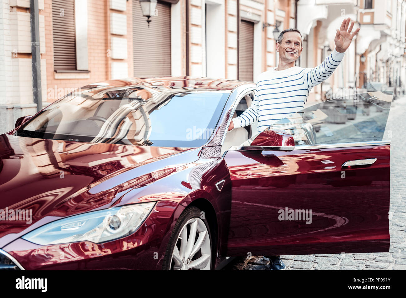 Happy man waving his hand Stock Photo - Alamy