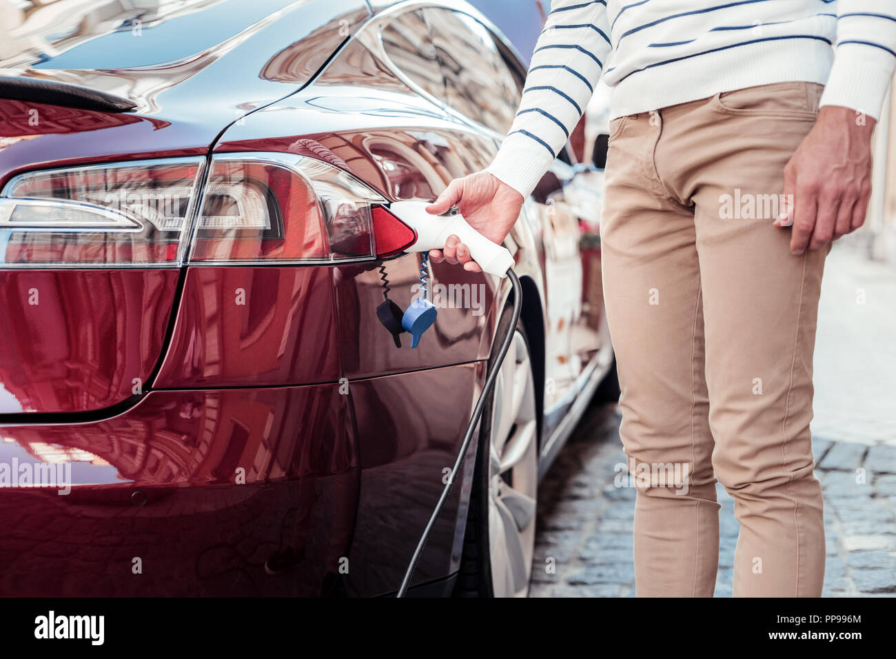 Close up of male person that standing near car Stock Photo - Alamy