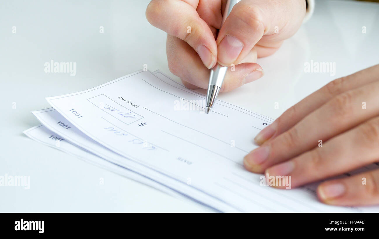 Writing check close up pay hi-res stock photography and images - Alamy