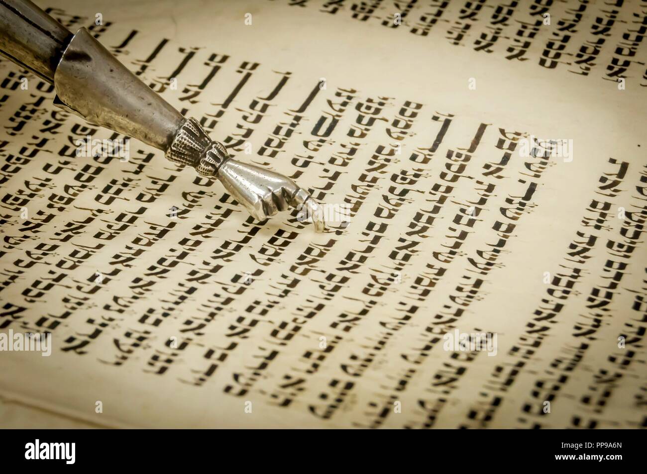 Torah pointer with a hand at the end with one finger extended to help ...