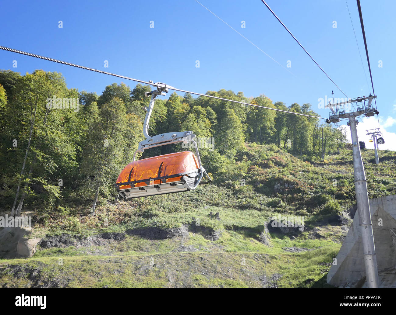 Cableway cabin riding on rope Stock Photo - Alamy