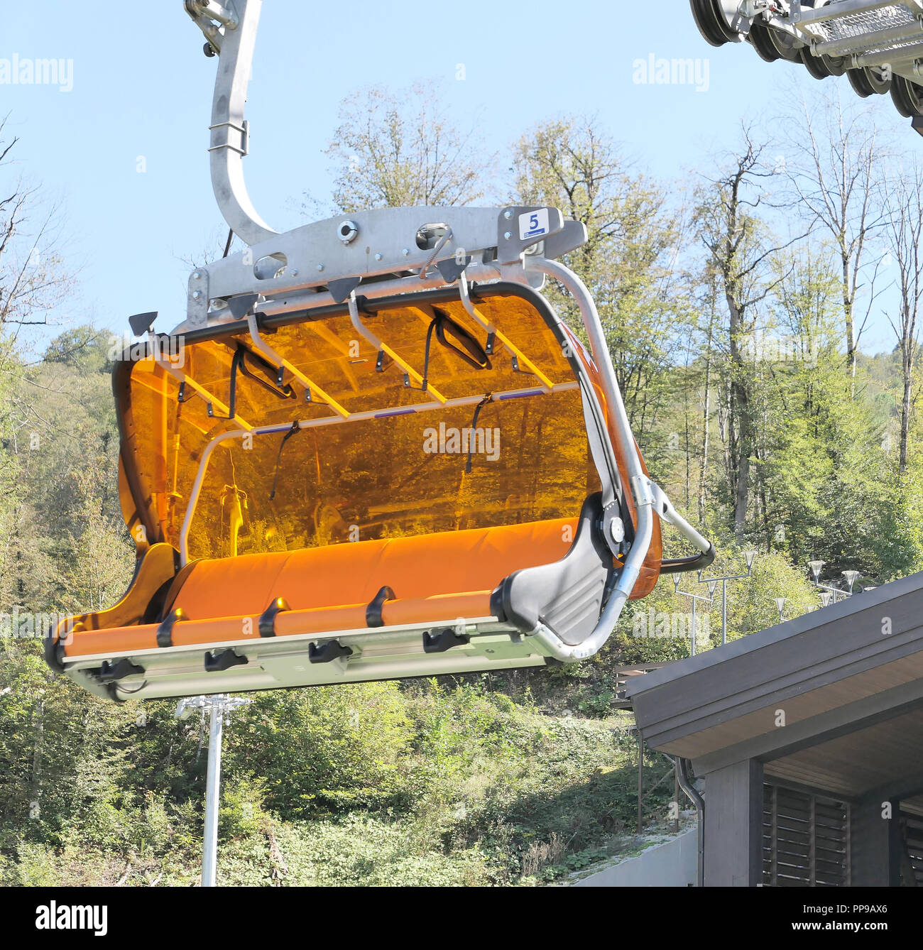 Cableway cabin riding on rope Stock Photo - Alamy