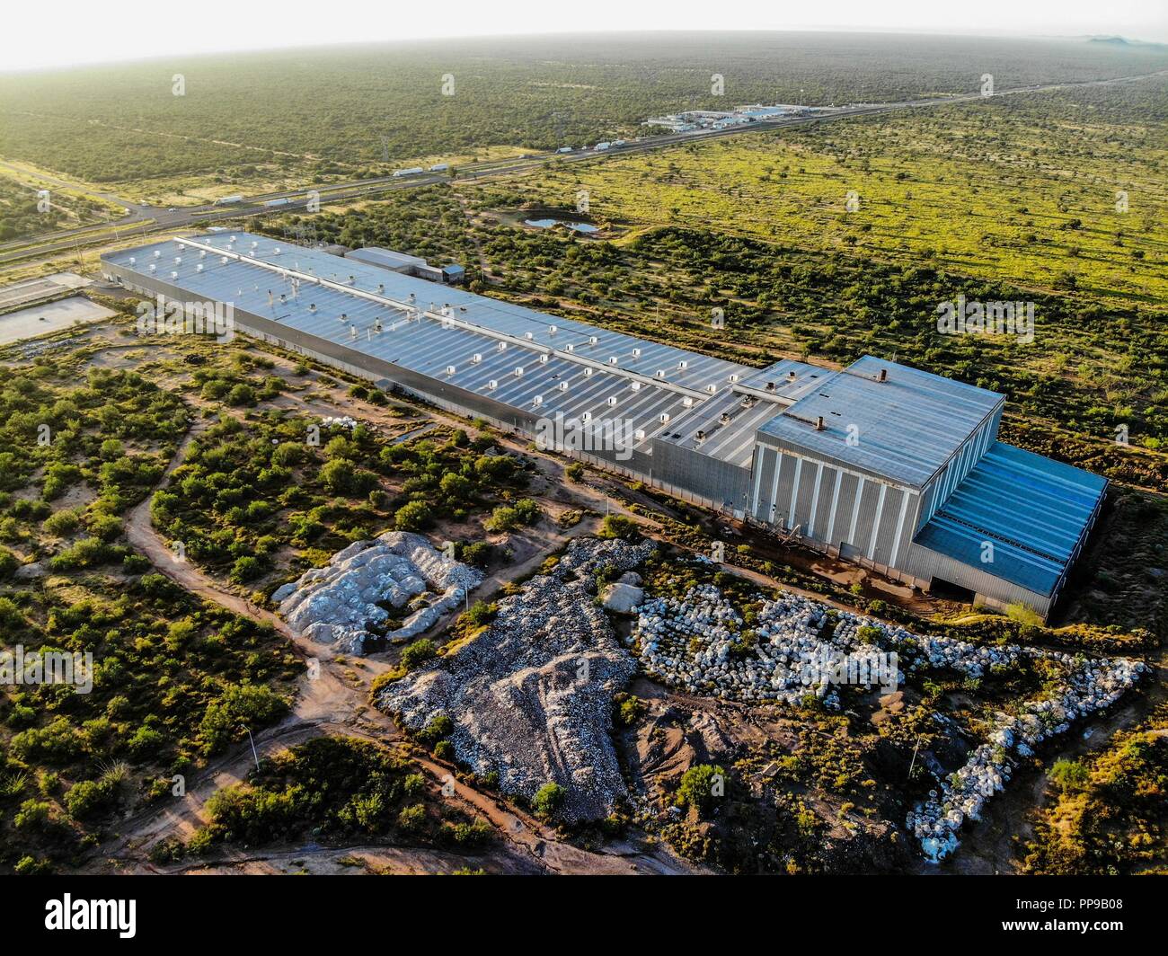 mining waste, desechos de mineria, .Aerial view of industrial warehouse ...