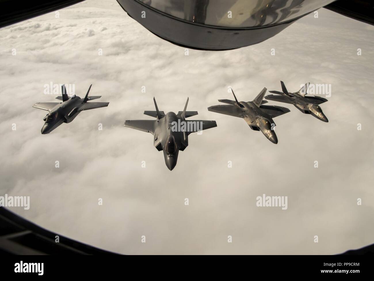 Two F-22 Raptors from the 95th Fighter Squadron, 325th Fighter Wing ...