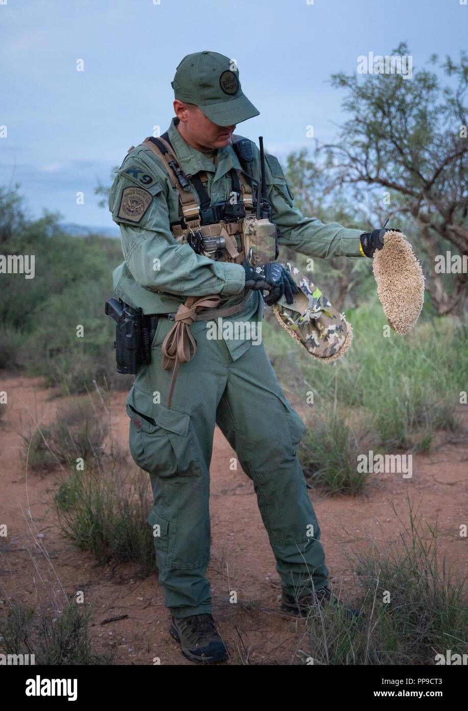 A Border Patrol agent, a member of Tucson Sector's Mobile Response Team ...