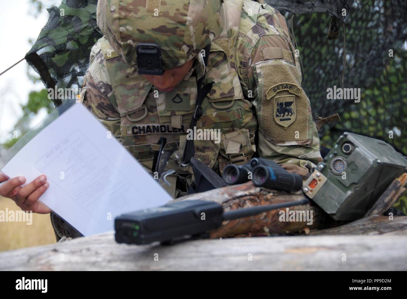Pfc. Brandon Chandler, assigned to U.S. Army Africa, prepares a call ...