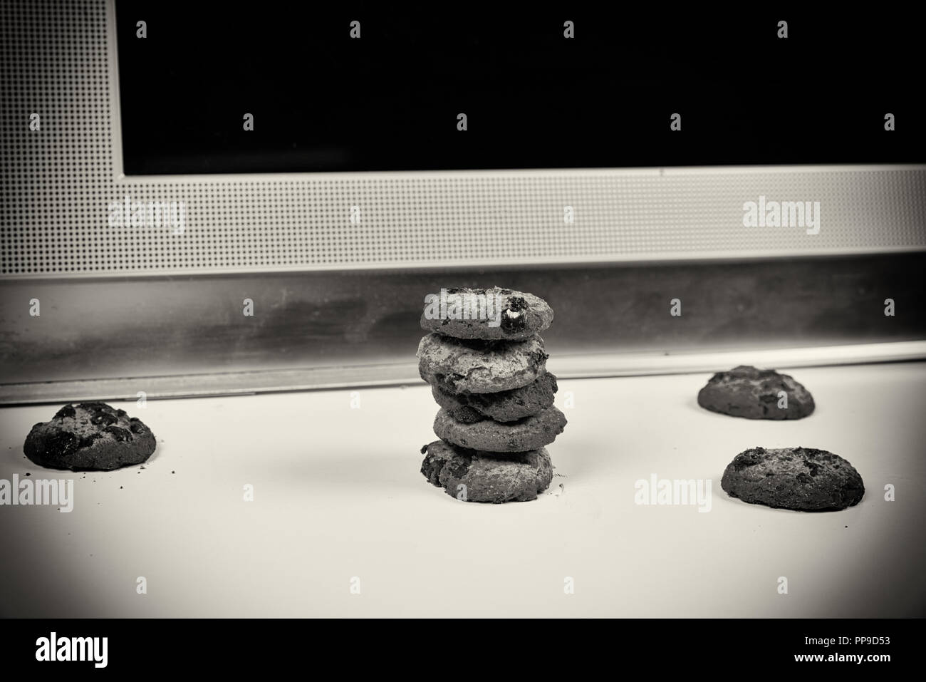Cookies in front of a computer, a concept Stock Photo - Alamy
