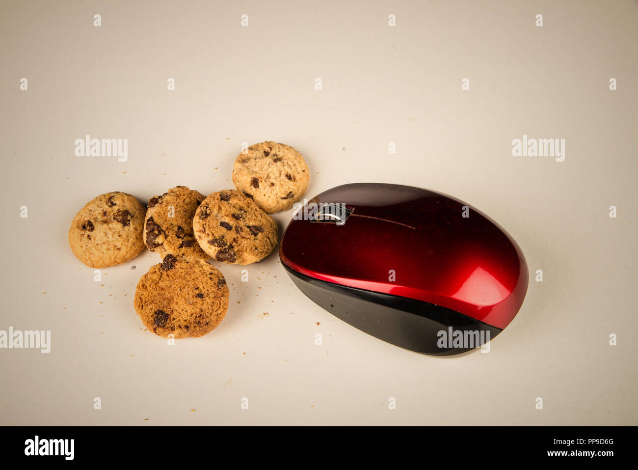 Mouse eating cookies, a funny technology concept Stock Photo - Alamy