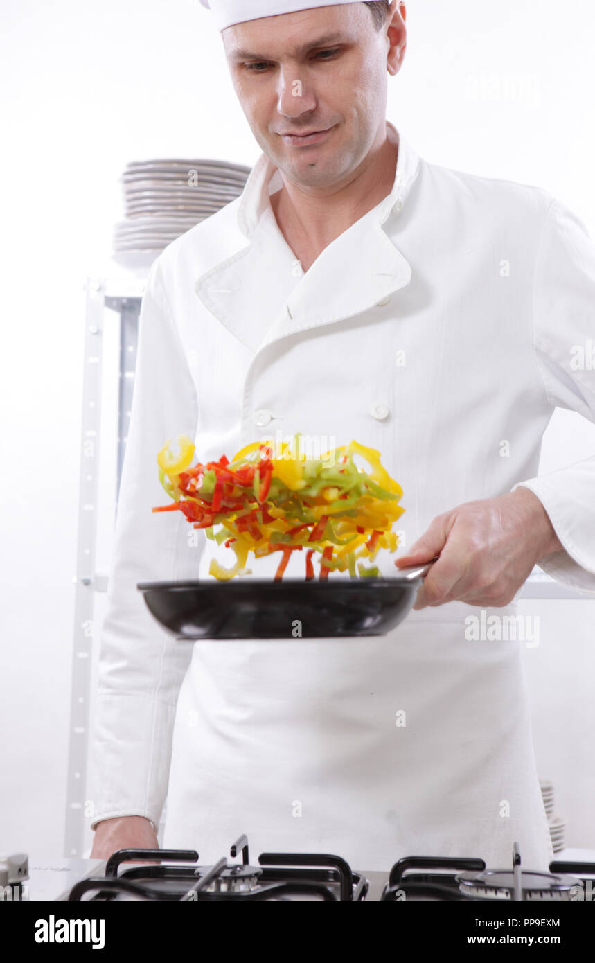 Chef roasting vegetables on a kitchen Stock Photo - Alamy