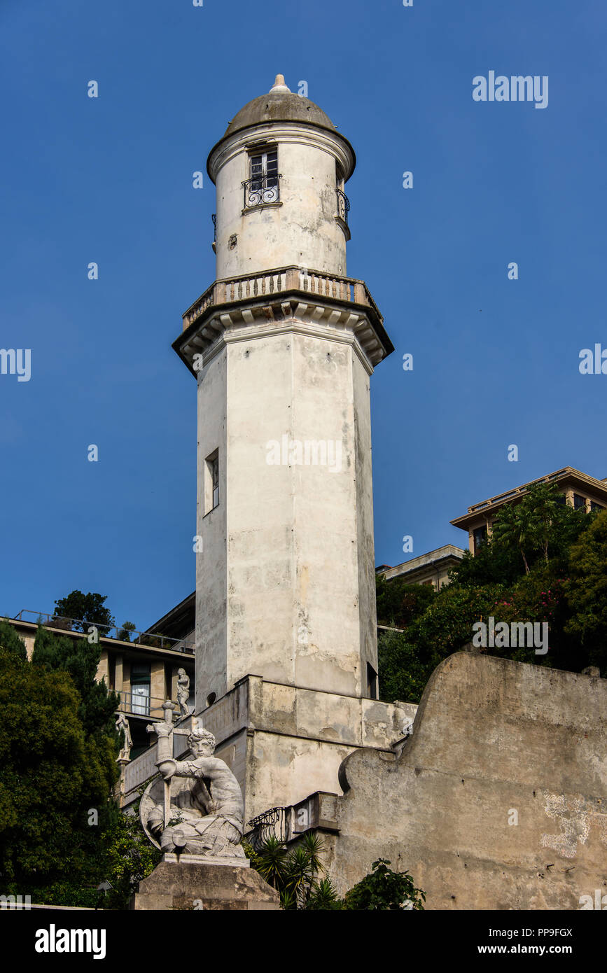 White tower and statue in the center of Genoa Stock Photo - Alamy