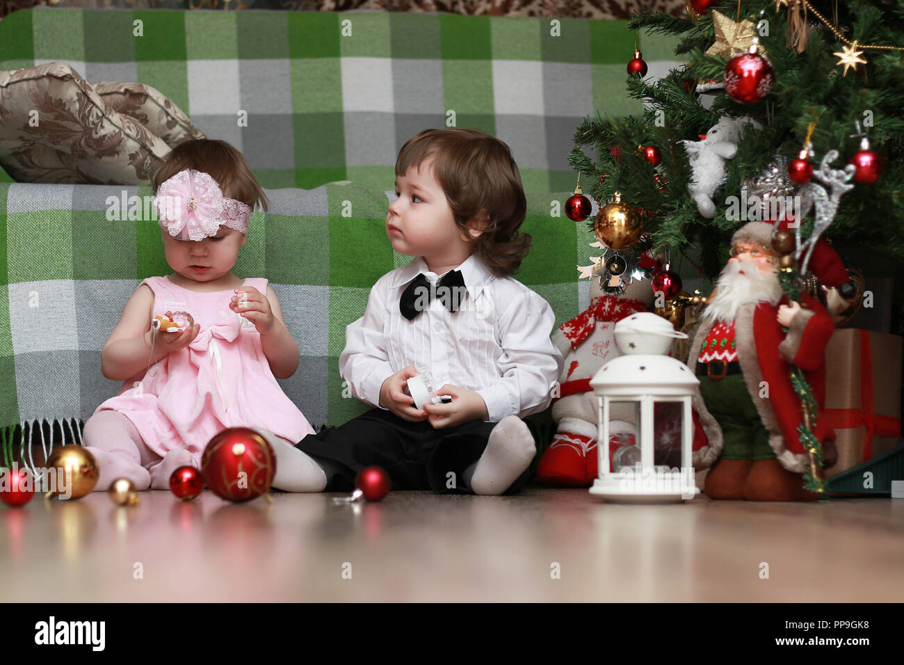 Little children near a Christmas Stock Photo - Alamy