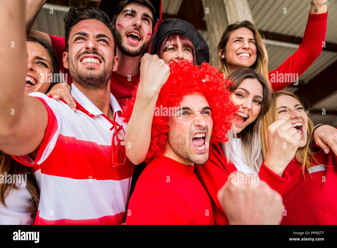 Football supporters at the stadium - Football fans having fun and ...