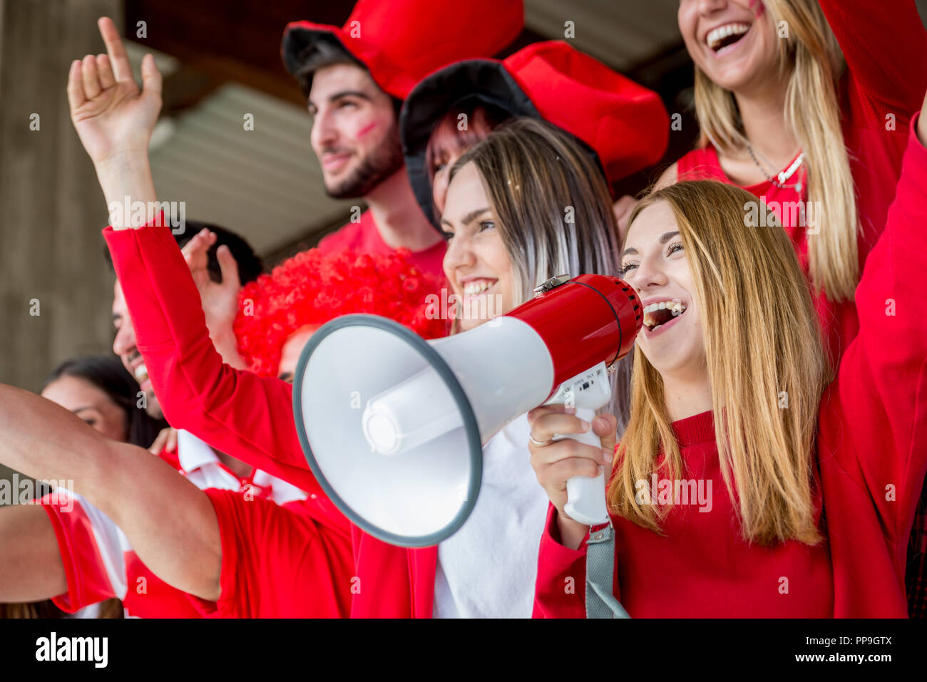 Football supporters at the stadium - Football fans having fun and ...