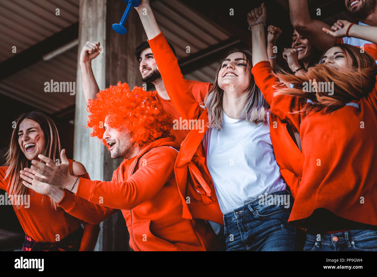 Football supporters at the stadium - Football fans having fun and ...