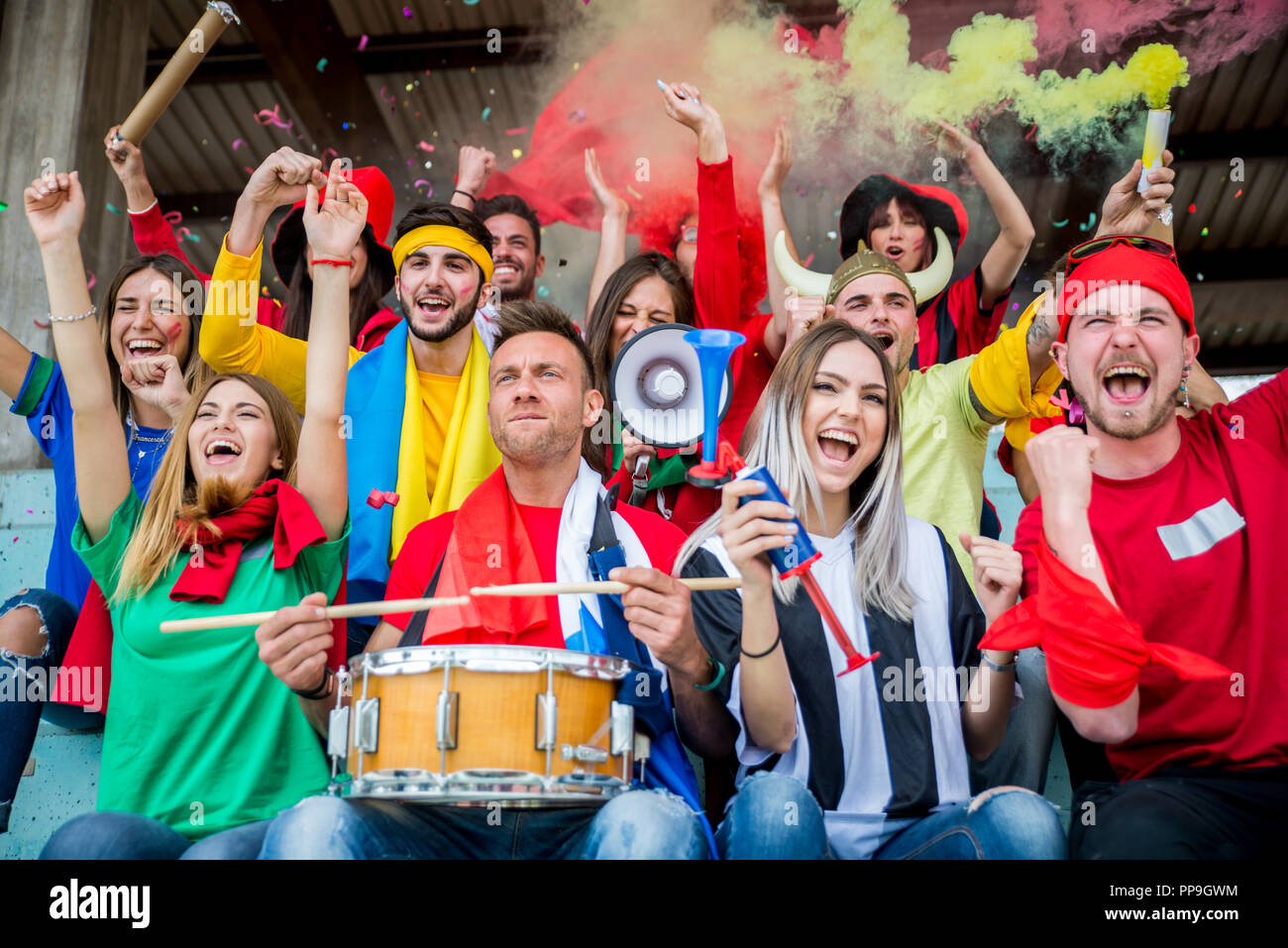 Football supporters at the stadium - Football fans having fun and ...