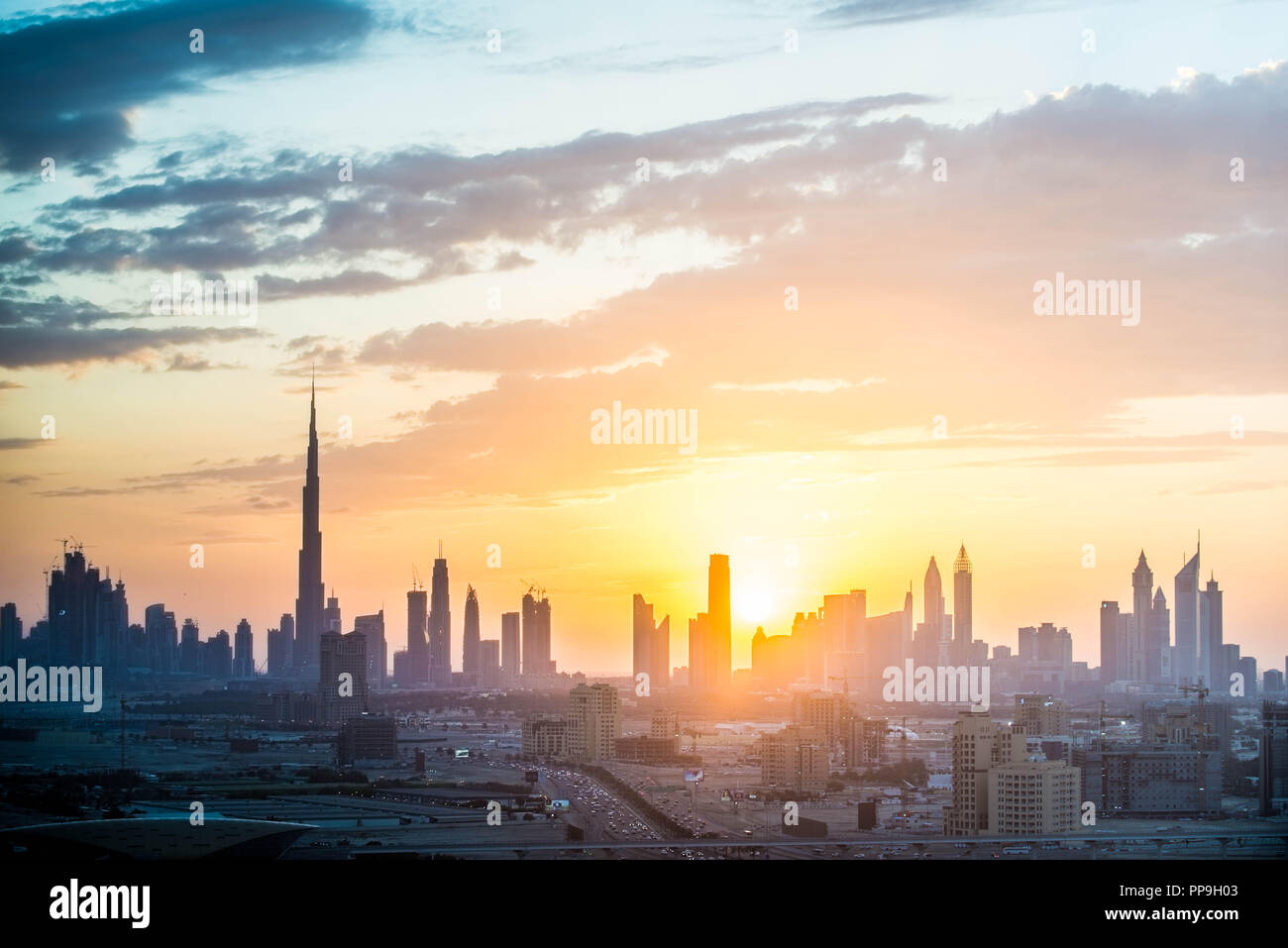Dubai skyline at sunset Stock Photo - Alamy