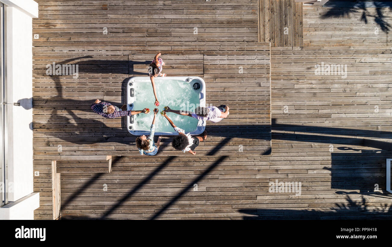 Group of friends having fun on a penthouse terrace, view from above ...