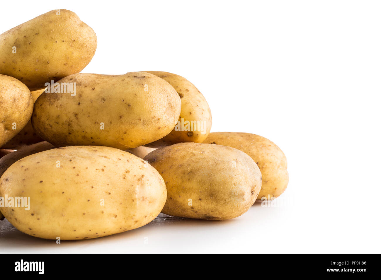 A pile washed potatoes isolated on white background Stock Photo - Alamy