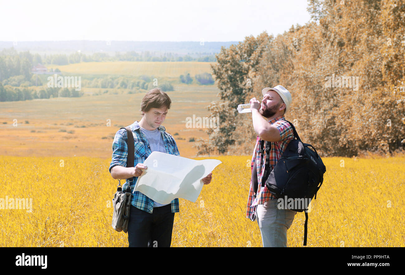 A young man looks at a map Stock Photo - Alamy