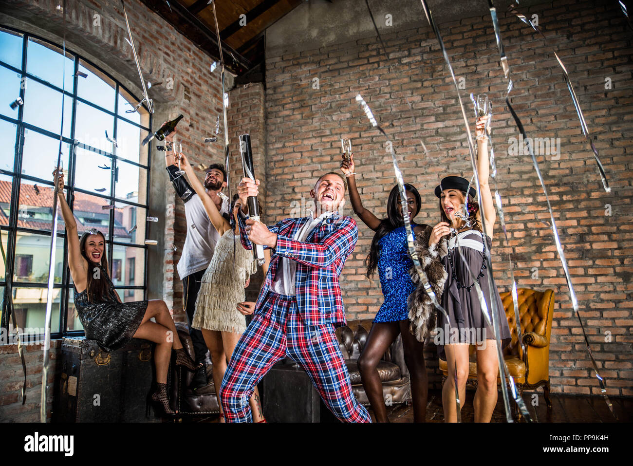 Multicultural group of friends having party - Happy people having fun ...