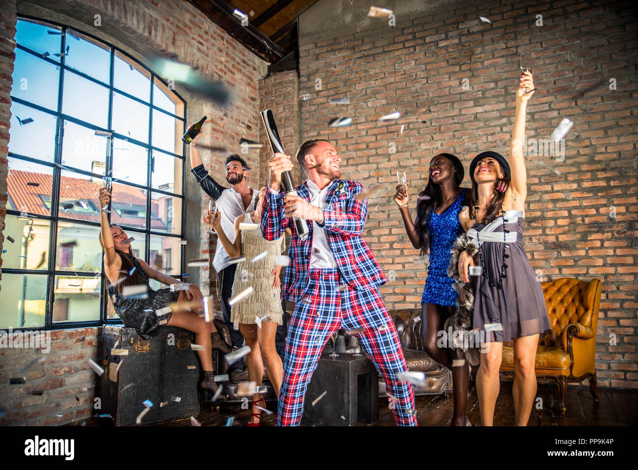 Multicultural group of friends having party - Happy people having fun ...