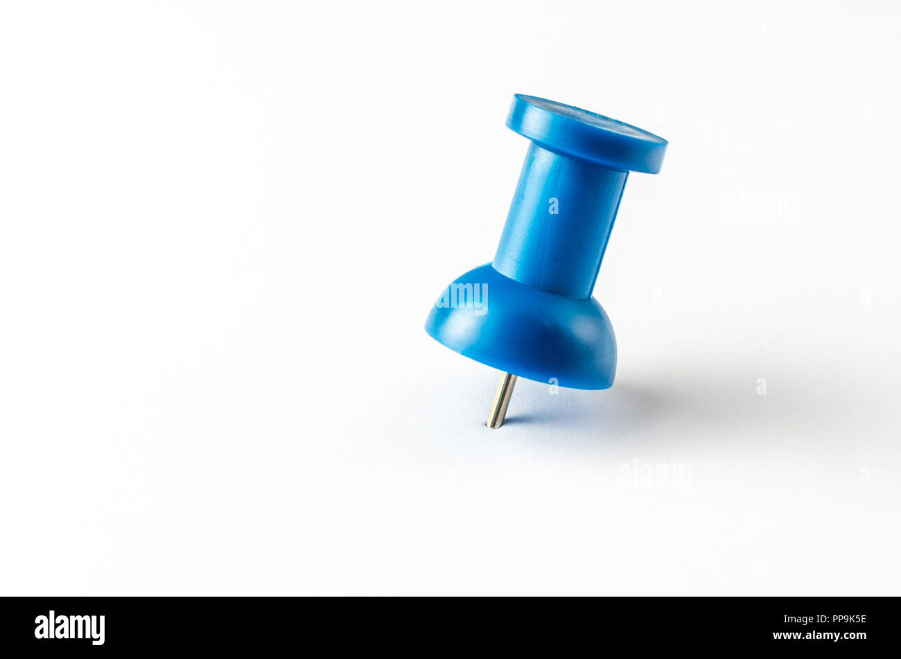 detail the different colored pins on a white background Stock Photo - Alamy