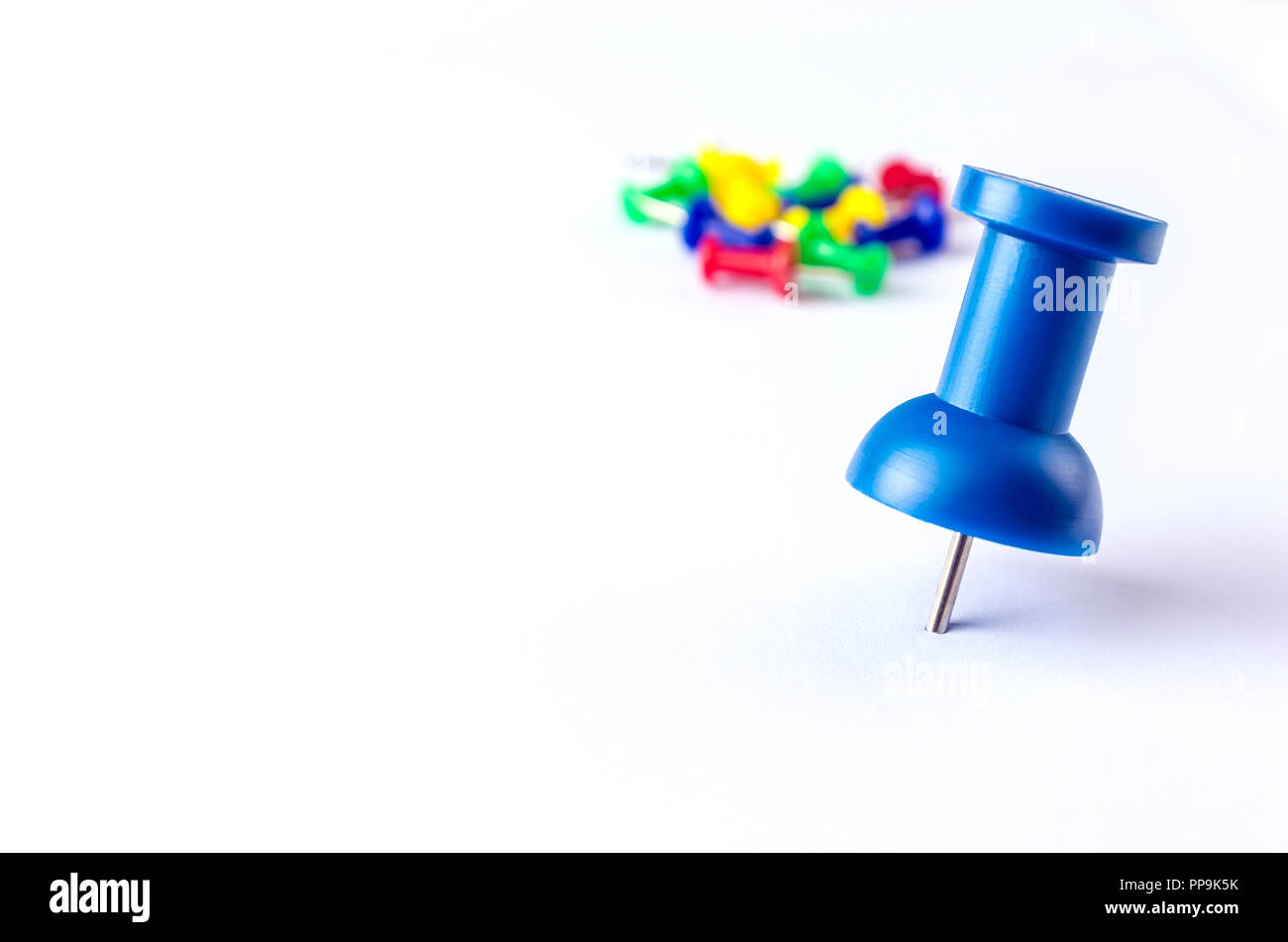 detail the different colored pins on a white background Stock Photo - Alamy