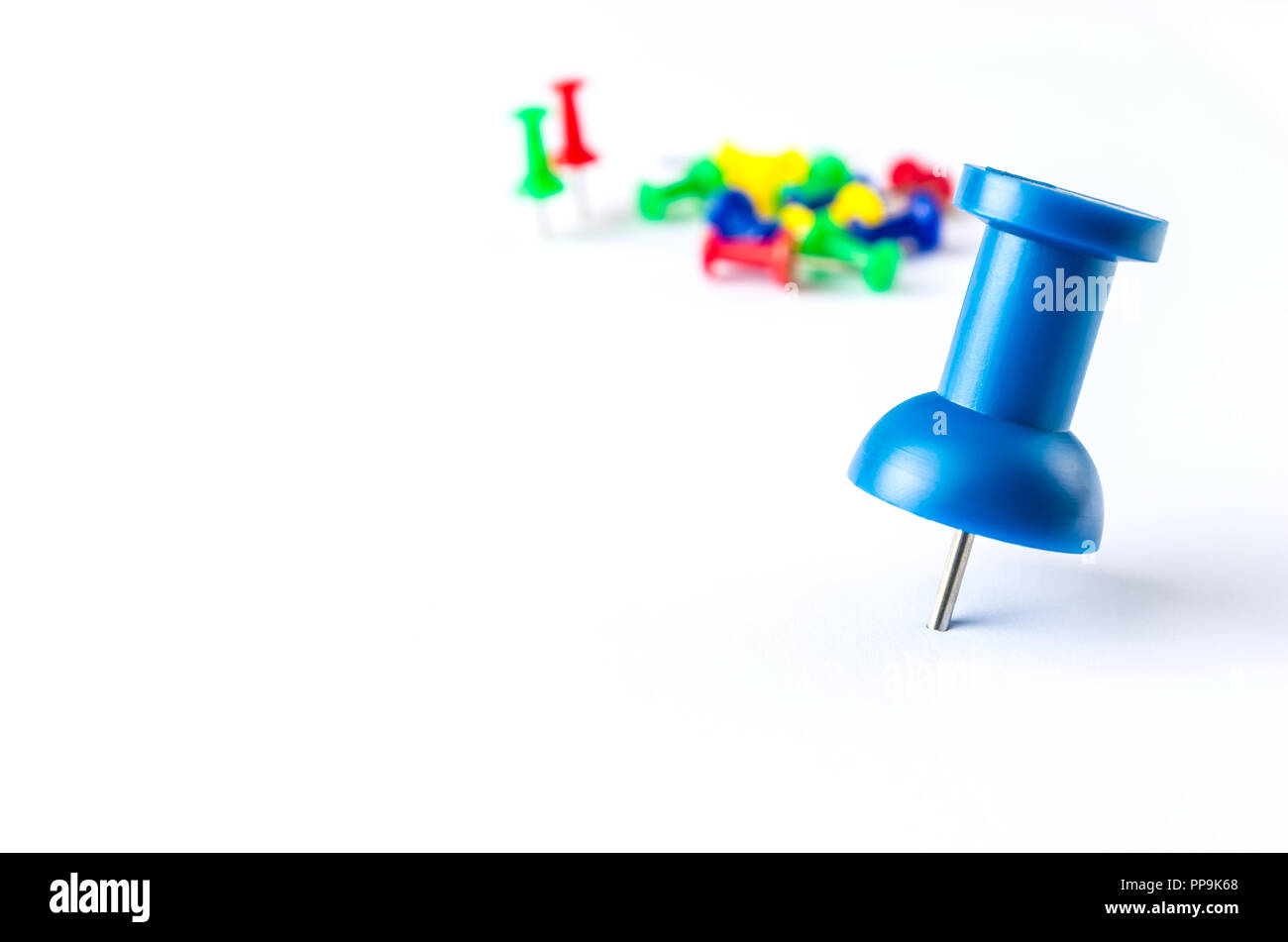 detail the different colored pins on a white background Stock Photo - Alamy