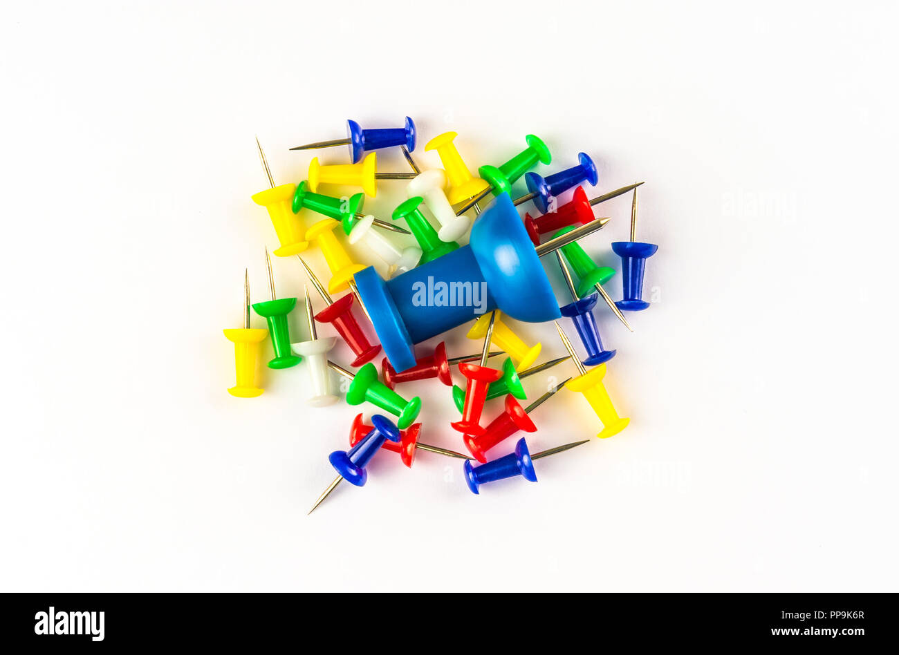 detail the different colored pins on a white background Stock Photo - Alamy