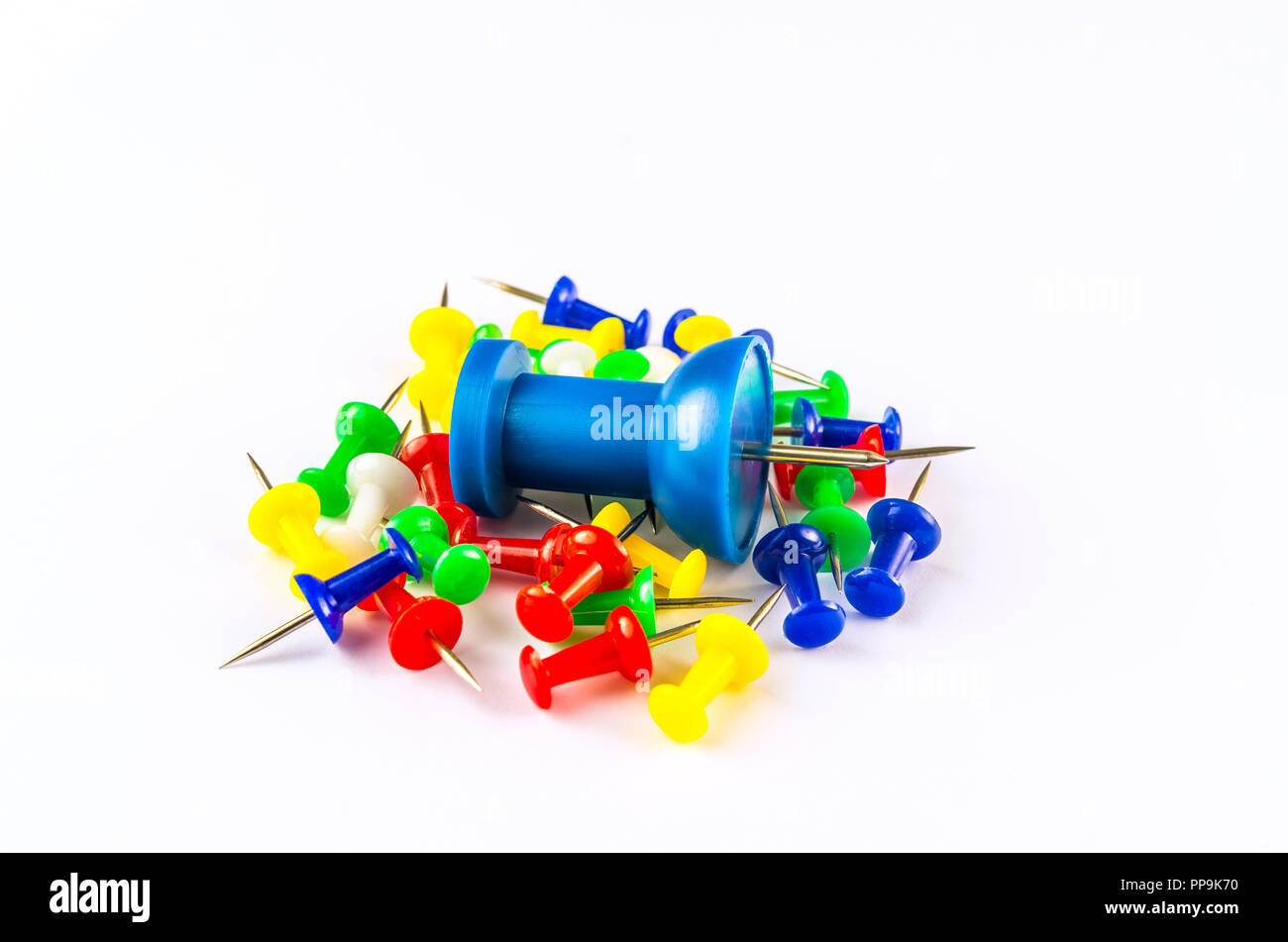 detail the different colored pins on a white background Stock Photo - Alamy