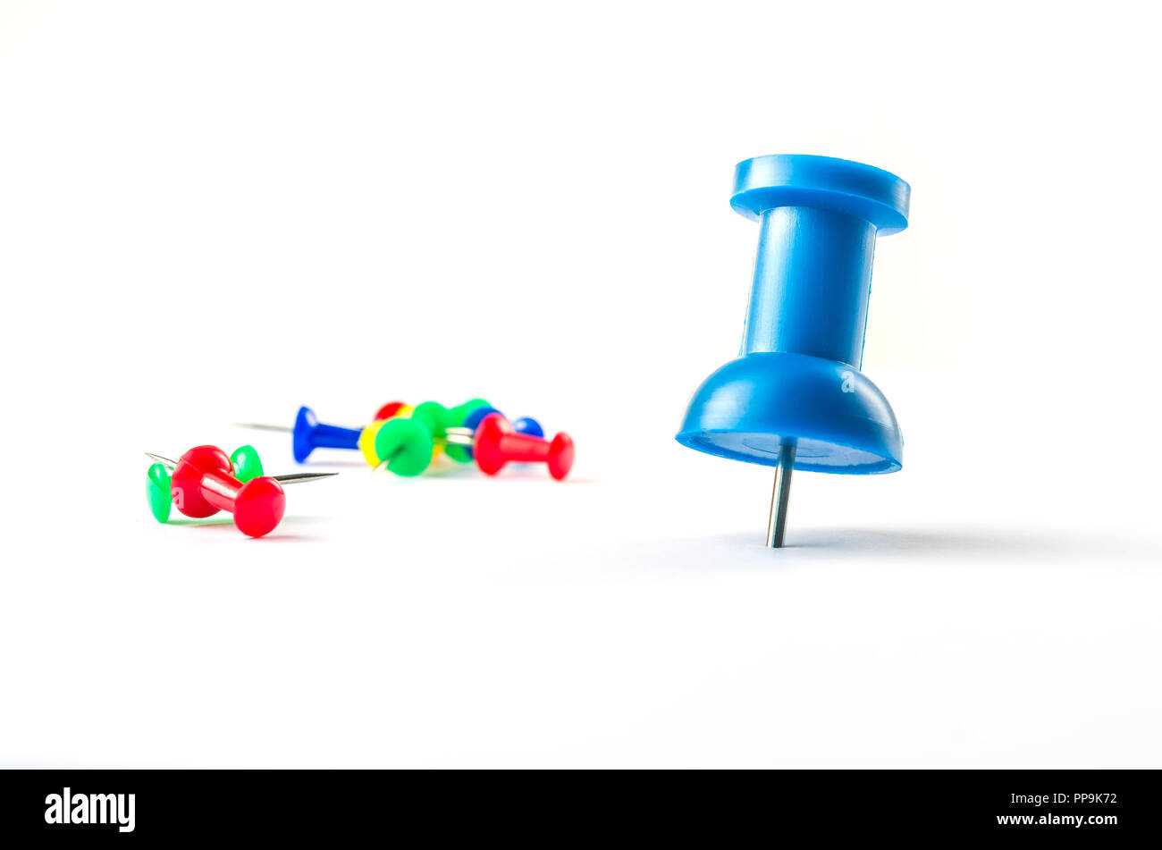 detail the different colored pins on a white background Stock Photo - Alamy