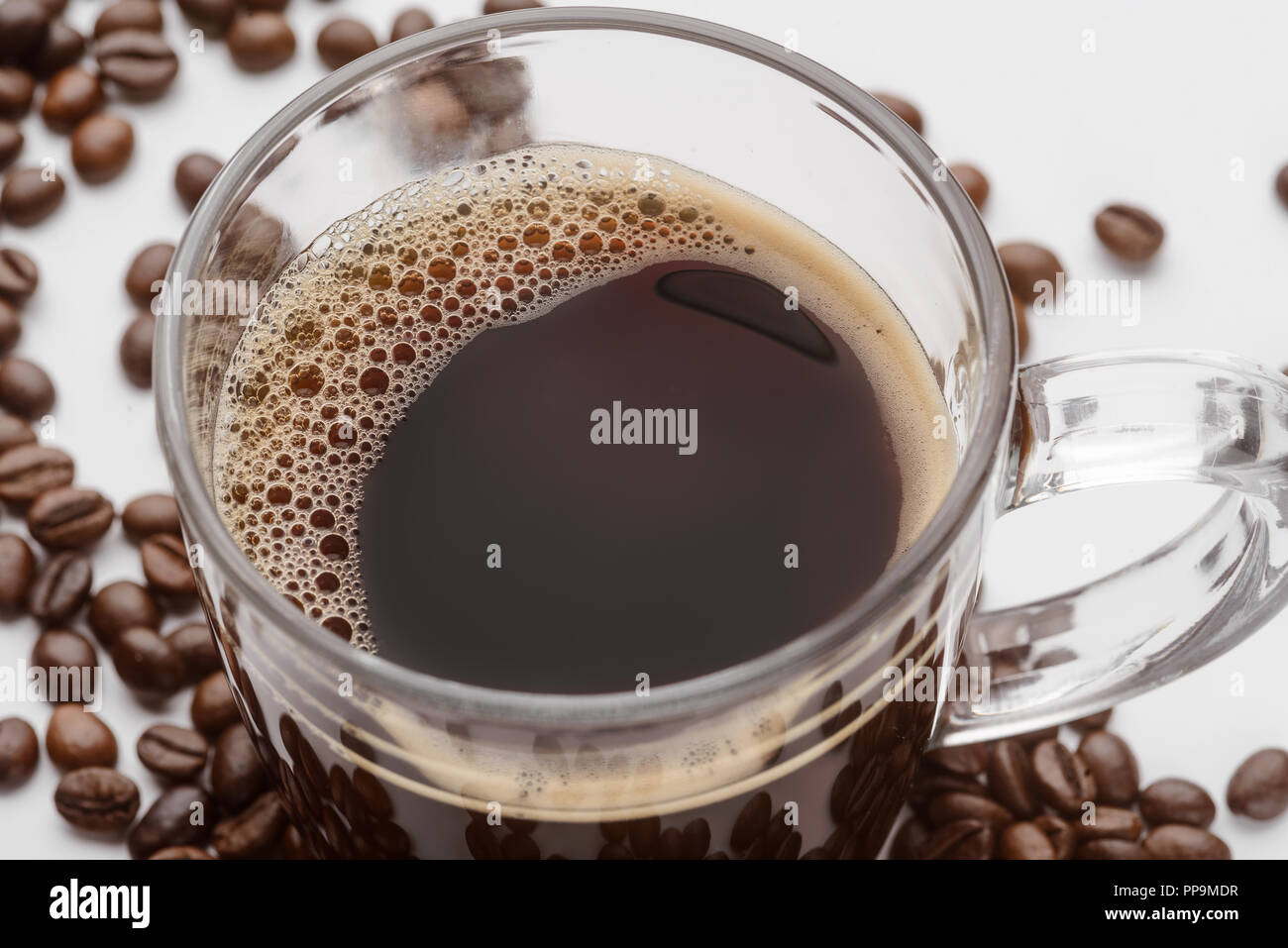 Glass mug with strong drink Stock Photo - Alamy
