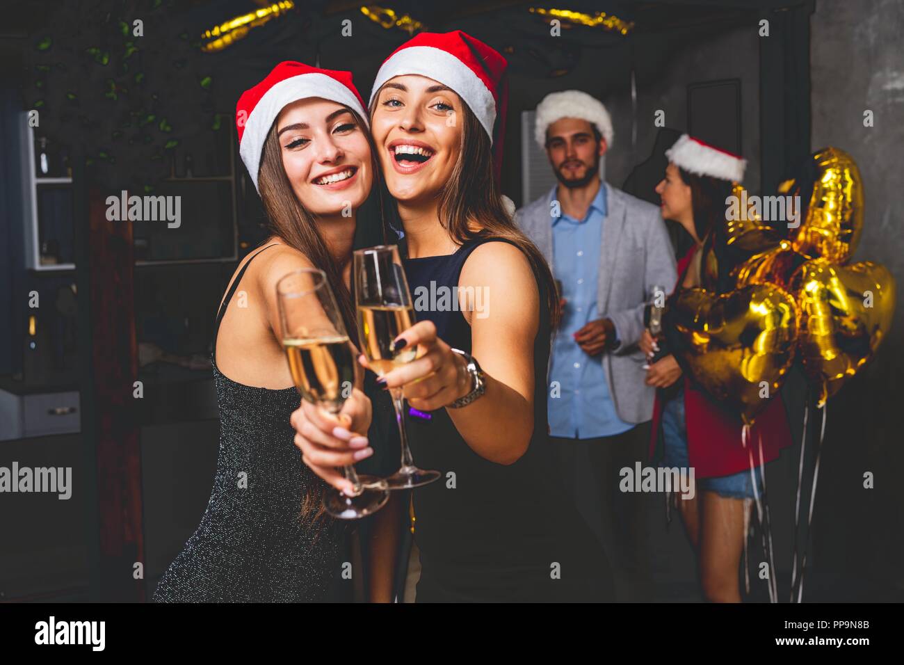 Picture showing best friends celebrating New Year Stock Photo - Alamy
