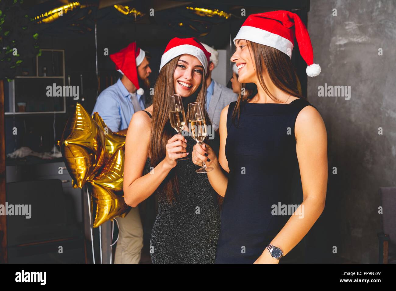 Picture showing best friends celebrating New Year Stock Photo - Alamy