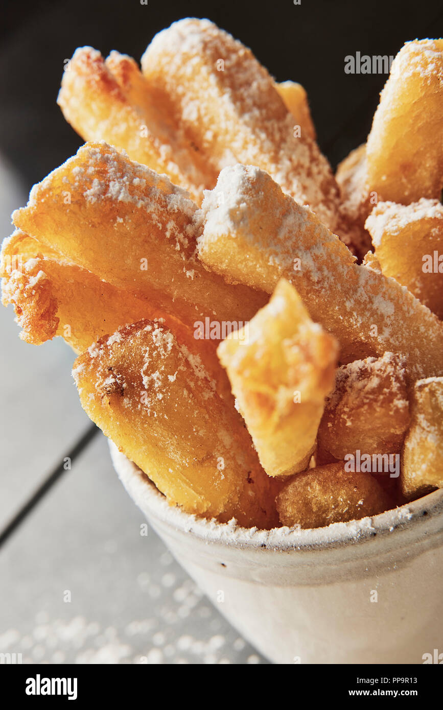 delicious crispy cod fish on white plate with chips in a bowl with ...